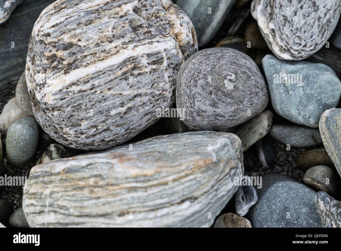 River stones in typical random pattern and type in New Zealand Stock ...