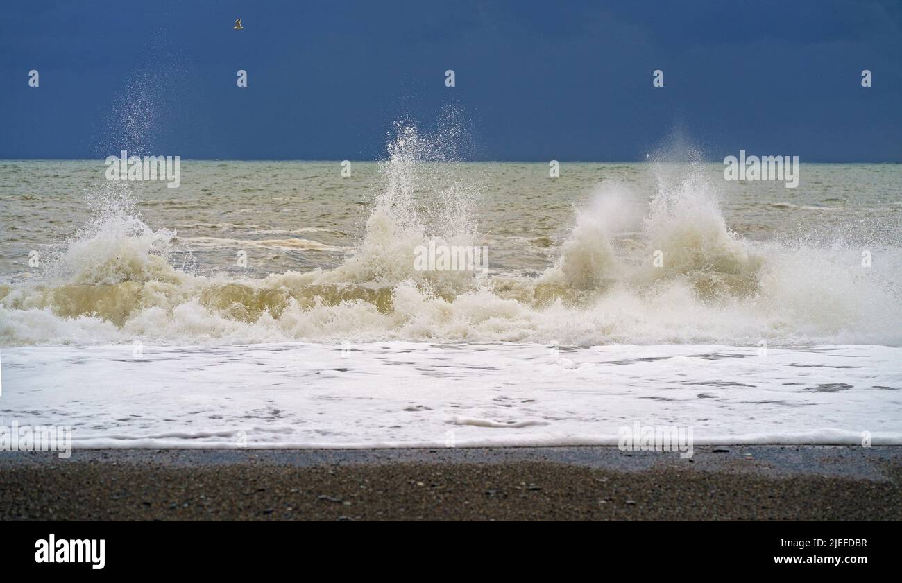 Coast of the Black Sea. Storm. High sea waves rise above the horizon ...