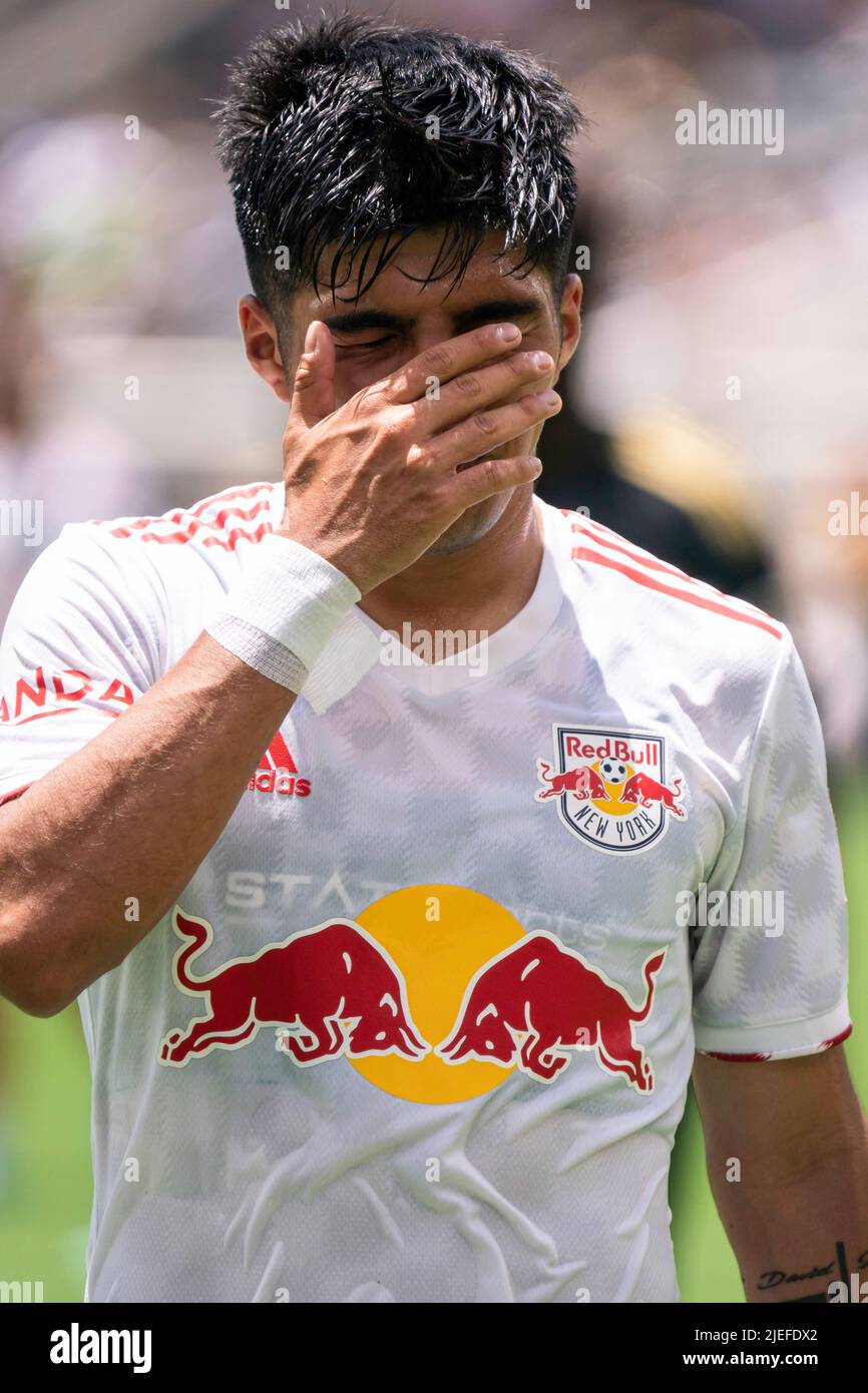 New York Red Bulls midfielder Omir Fernandez (21) reacts to the heat ...
