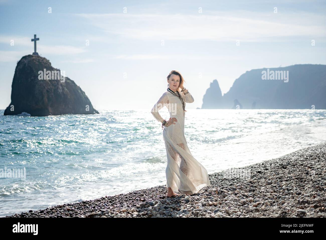 Woman in bohemian clothing on beach at sunset. Boho style for ...