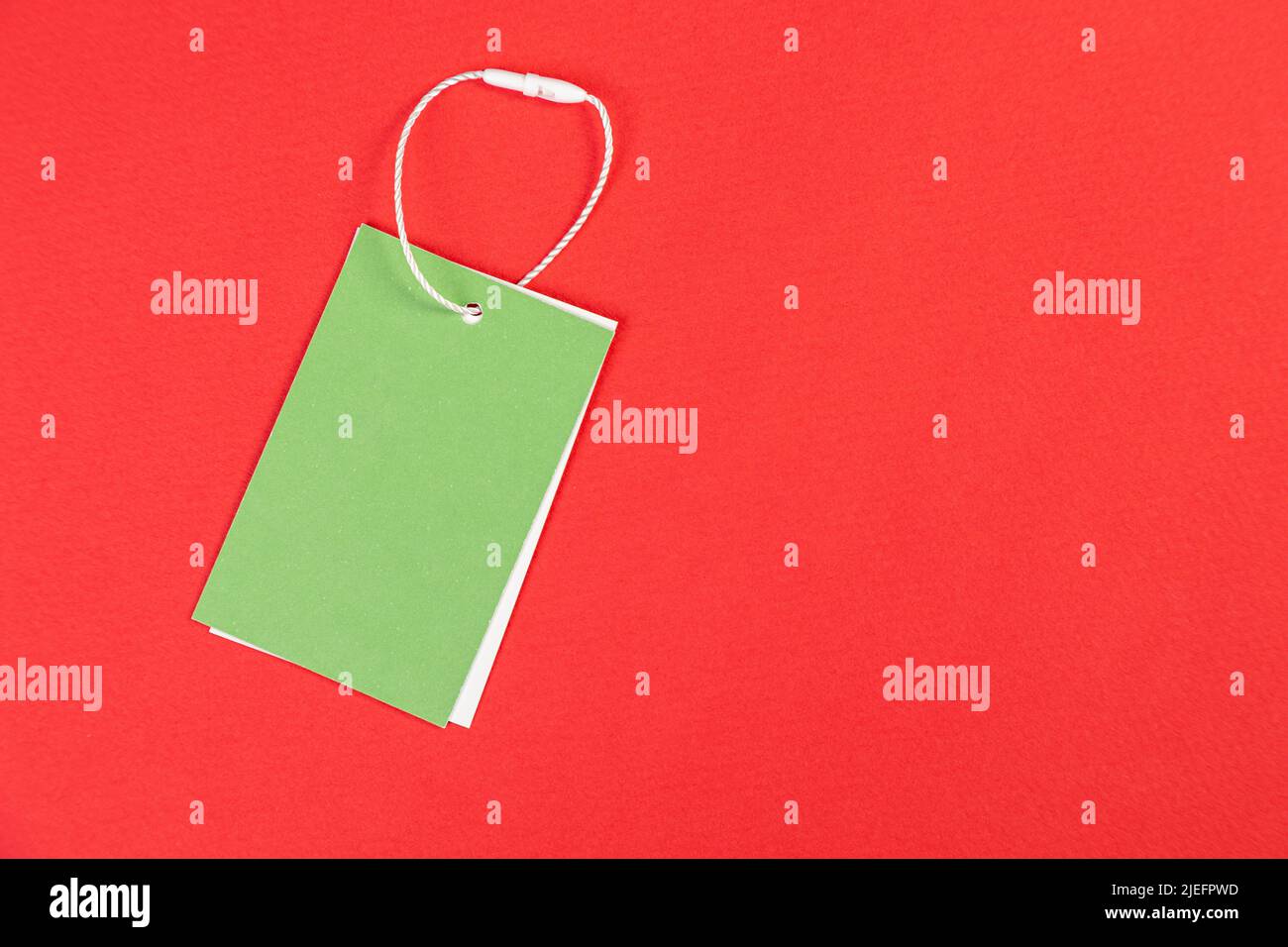 white price tag on a red background, price tag for goods Stock Photo ...