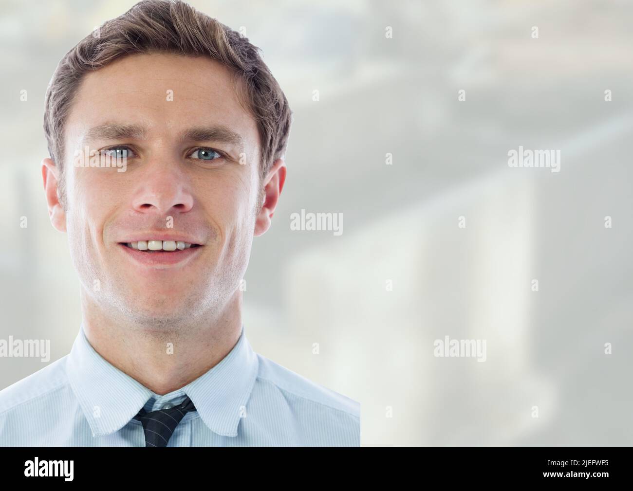 Composite image of caucasian businessman against blurred background ...