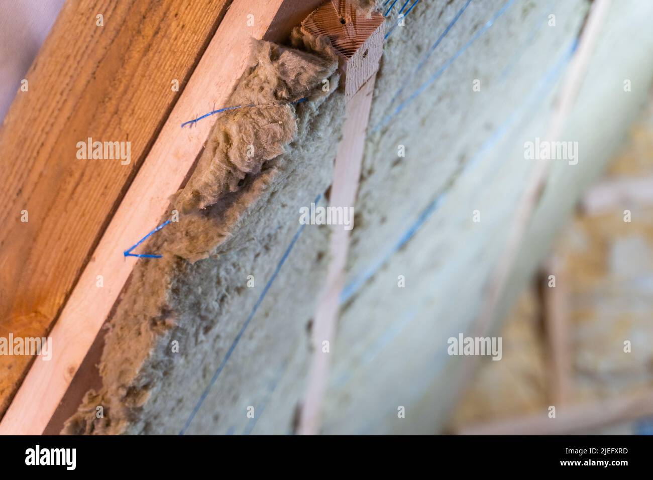 Thickness of mineral wool for roof insulation close-up Stock Photo - Alamy
