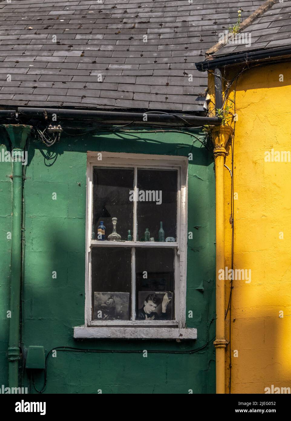 Limerick, Ireland - June 4, 2022: A window with the old figurines and ...