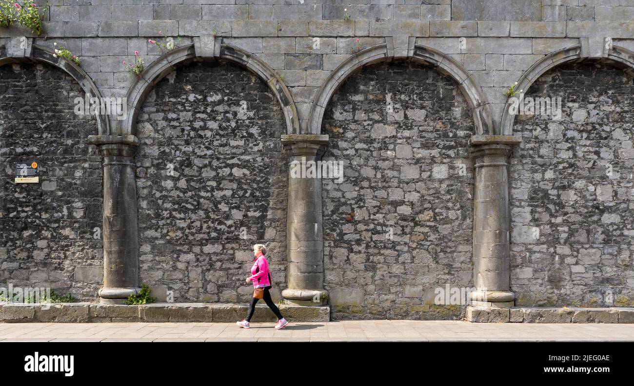Limerick, Ireland - June 4, 2022: A person walking past the exterior ...