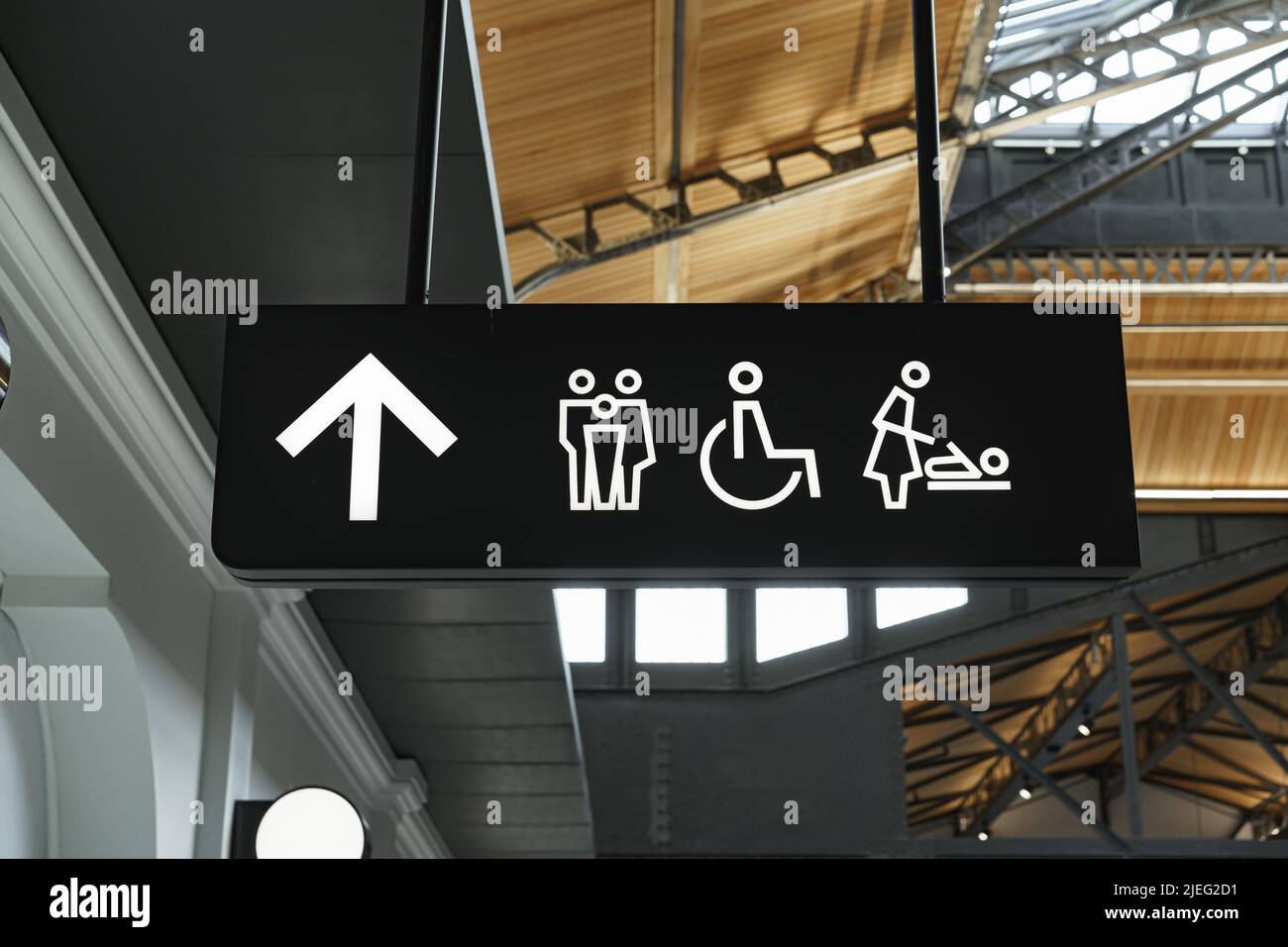 Modern public toilet sign on the wall Stock Photo - Alamy