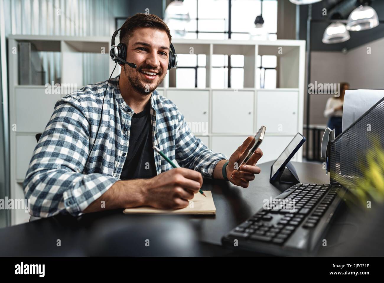 Customer service support operator man with headphones and microphone ...