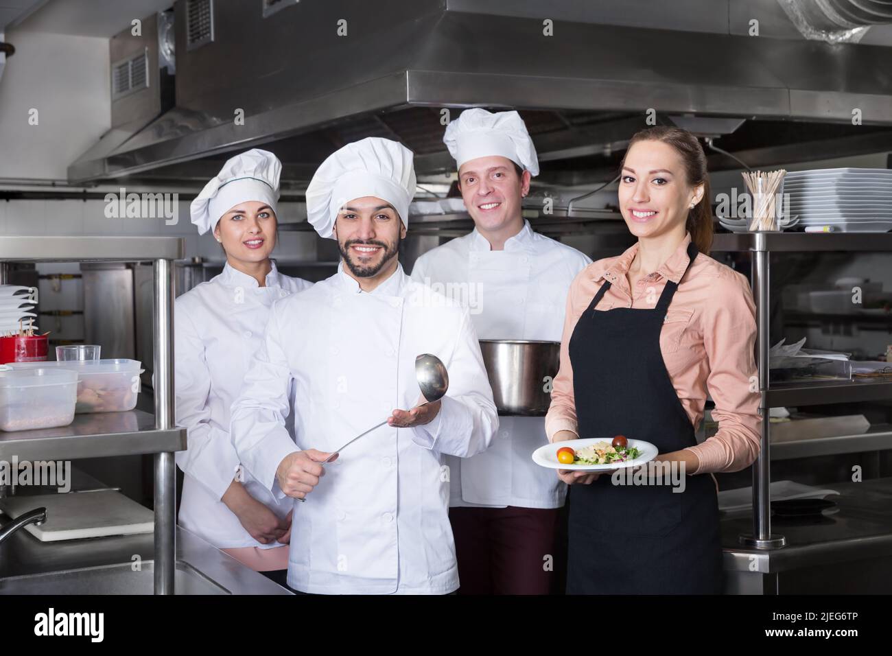 Team of restaurant staff posing together Stock Photo - Alamy