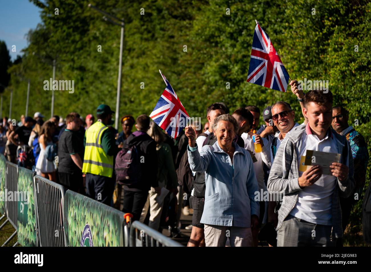 Members of the public wait in line to enter Wimbledon ahead of day one ...