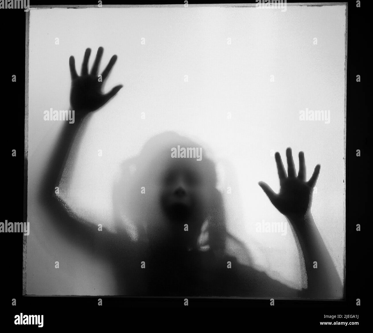 Horror ghost girl behind the matte glass in black and white. Halloween ...