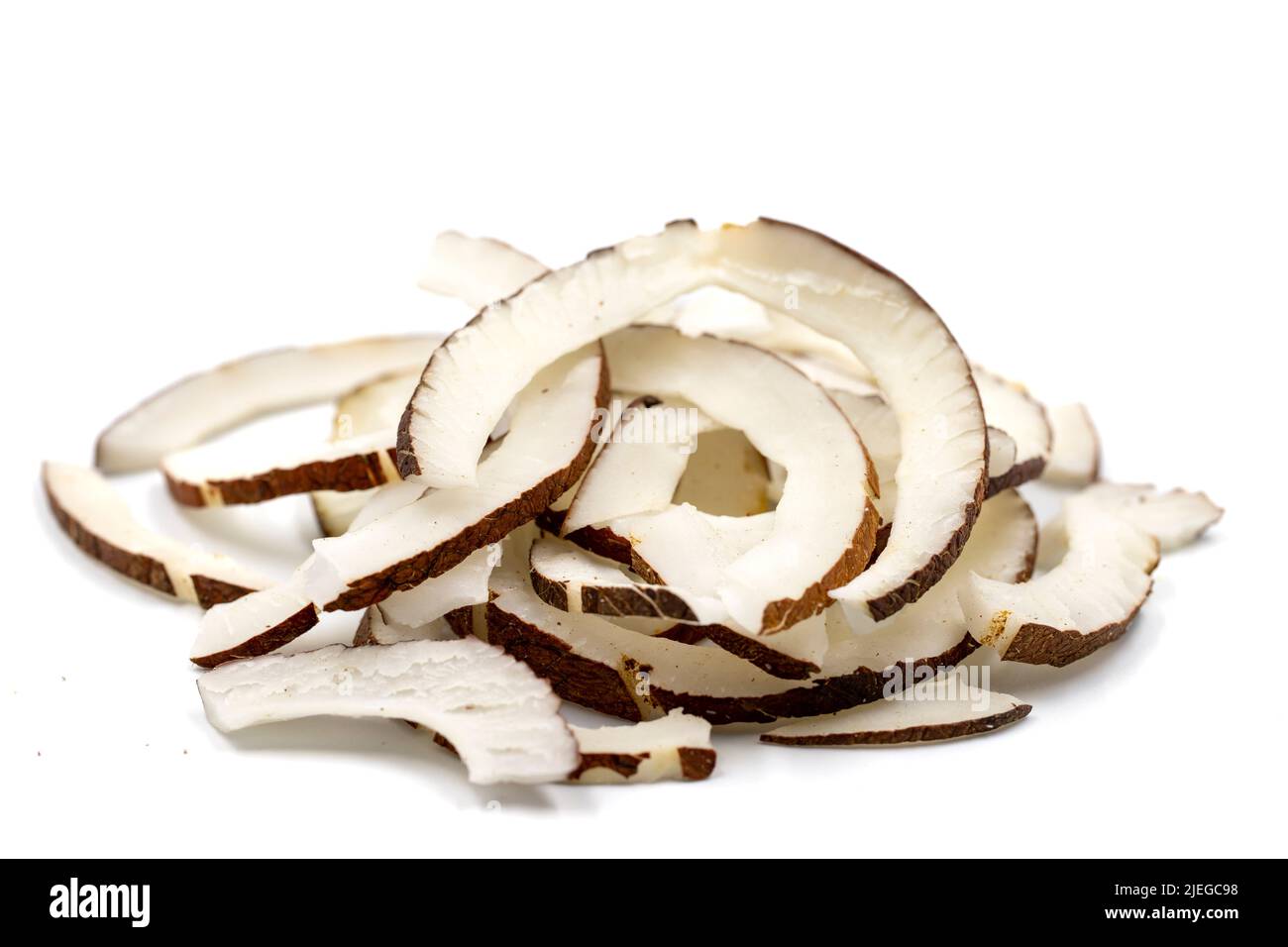 Dried coconut slices. Sliced dry coconut isolated on a white background ...