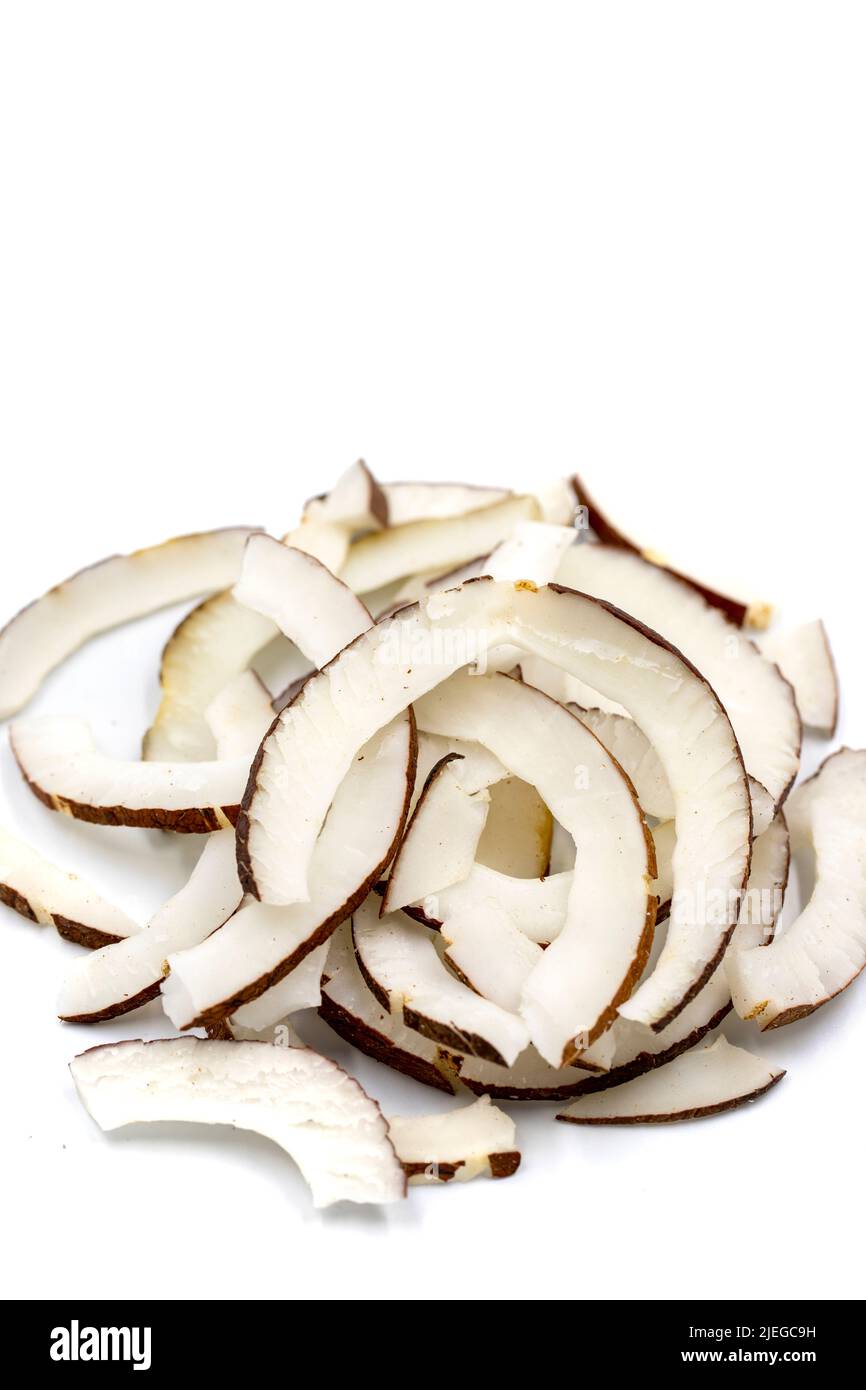 Dried coconut slices. Sliced dry coconut isolated on a white background ...