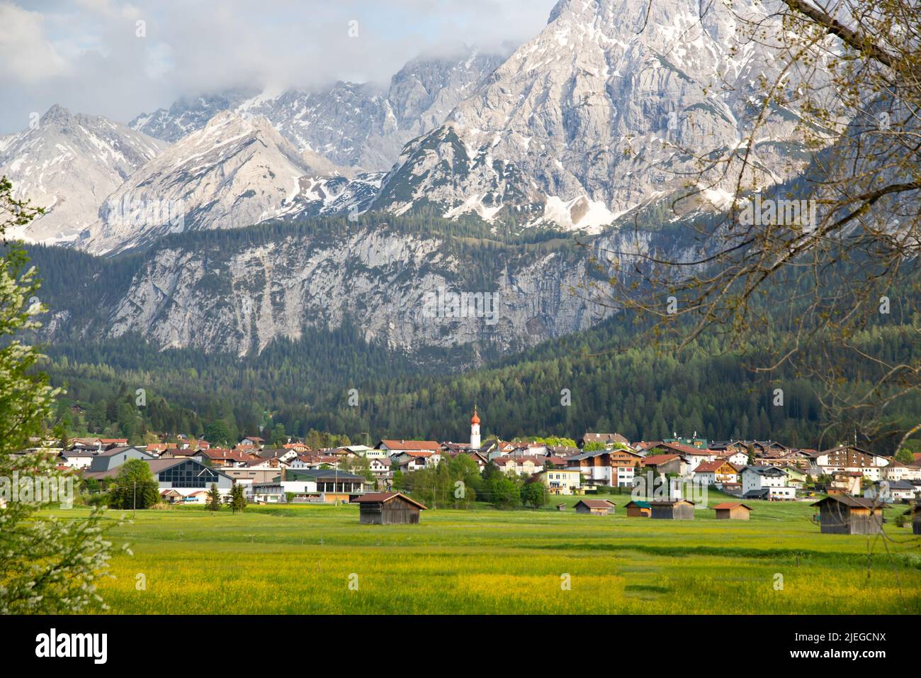 Small village in Austria with the Alps mountains in the background ...