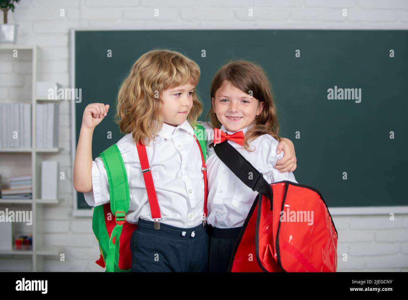 Back to school. Little school students, boys and girlat school ...