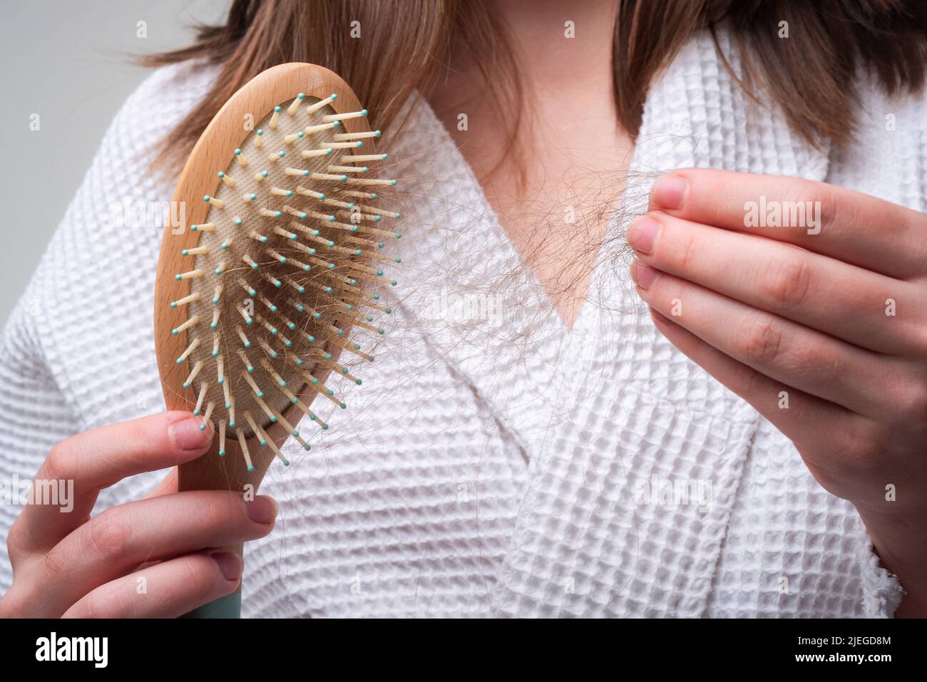 Concept of hair loss. Problem hair in comb, isolated. Damaged unhealthy ...