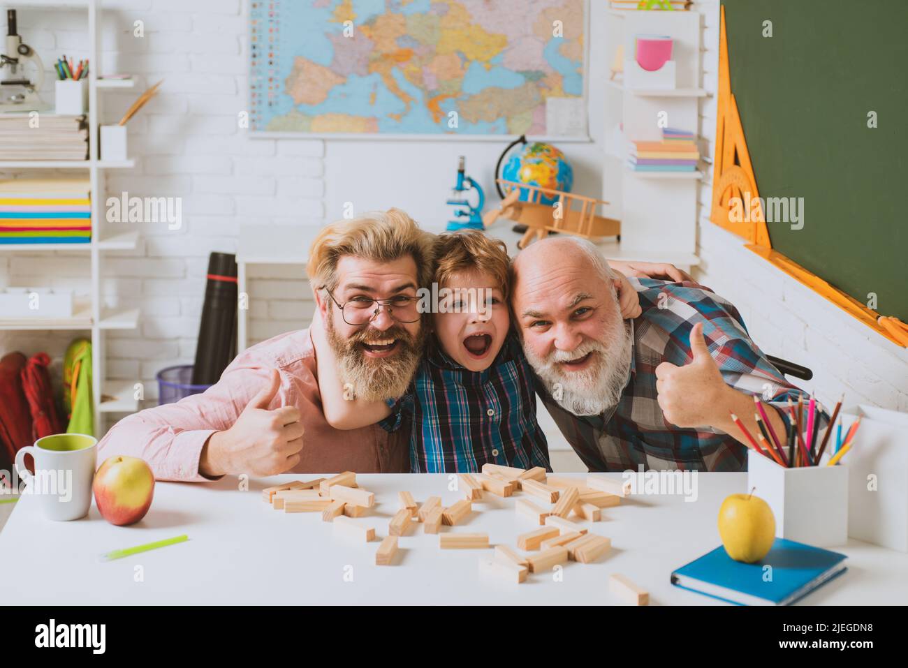 Portrait grandpa and grandson playing and learning. Family relationship ...