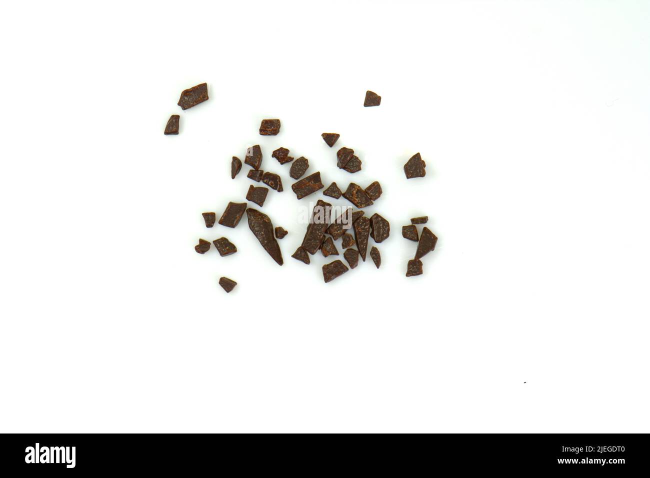 Grated chocolate. Heap of ground chocolate isolated on white background ...