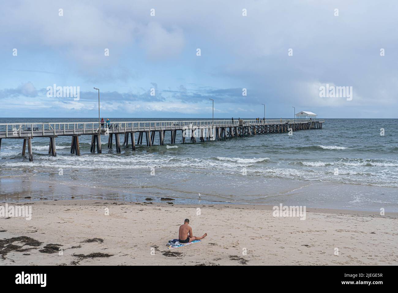 Adelaide Australia, 27 June 2022 . A swimmer on a stormy day and rough ...