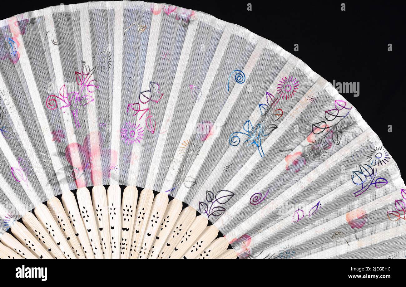 Hand fan isolated on black Stock Photo - Alamy