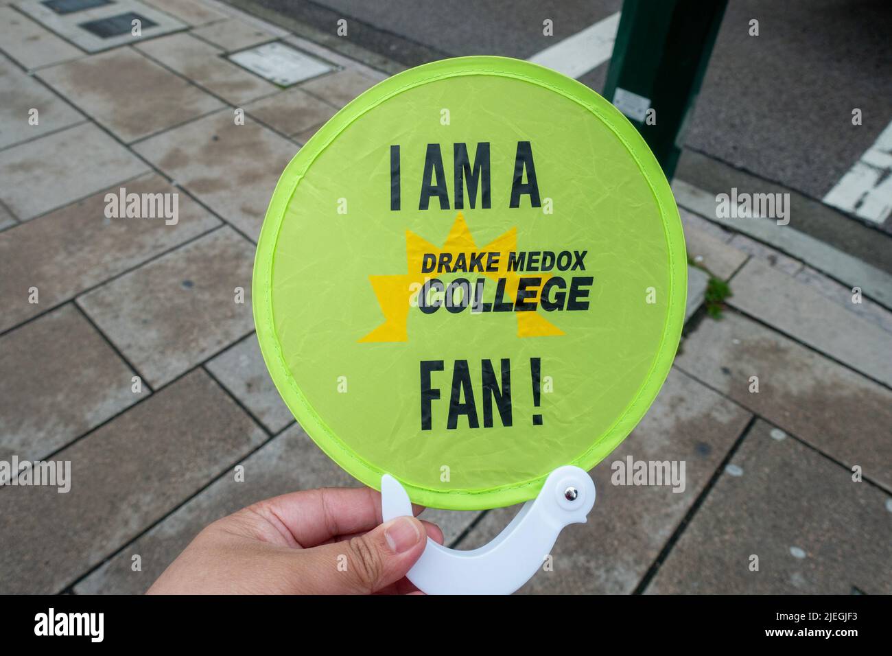Hand fan with Drake Medox College Advertisement Stock Photo - Alamy