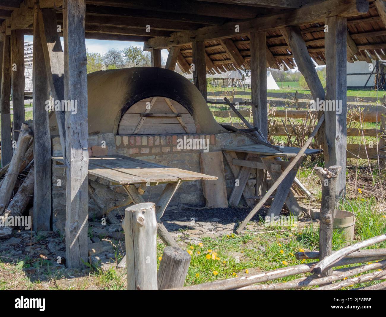 Medieval hut with baking oven in sunny ambiance Stock Photo - Alamy