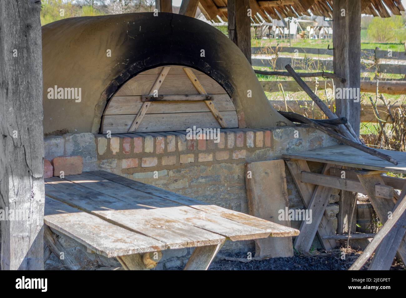 Medieval hut with baking oven in sunny ambiance Stock Photo - Alamy