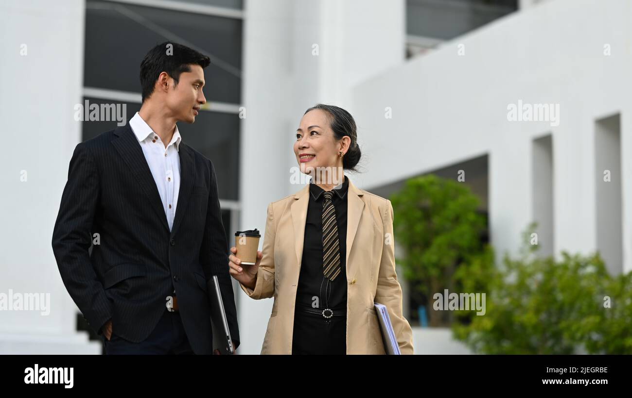 Two office workers smiling other hi-res stock photography and images ...