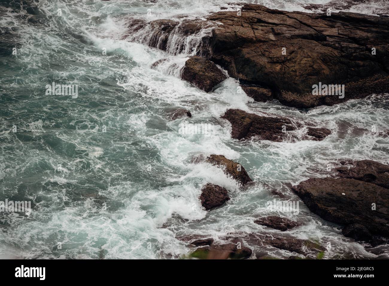 The scenery of the wave on the rocky bay Stock Photo - Alamy