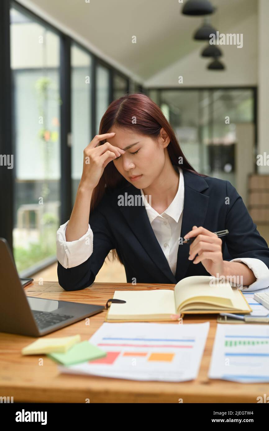 Frustrated young businesswoman stress from work or upset after finishing meeting. Emotional ...