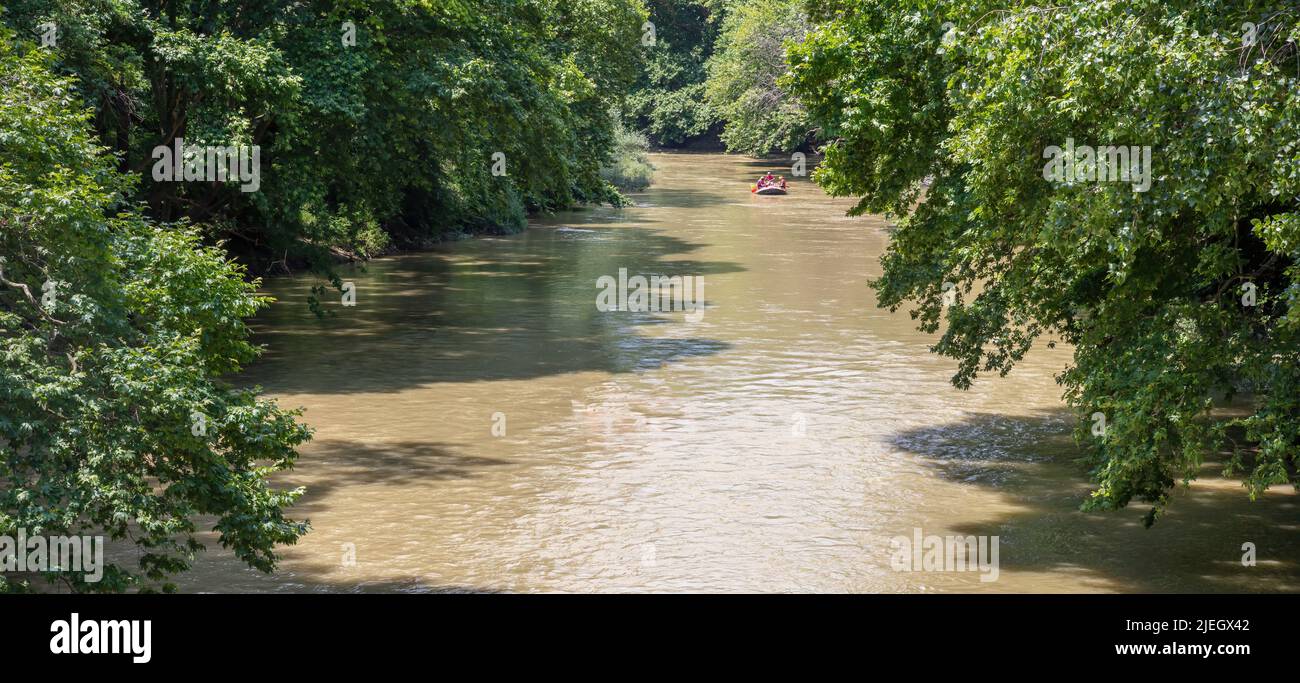 Greece. Vale of Tempi, Thessaly. Pineios River brown water flowing ...