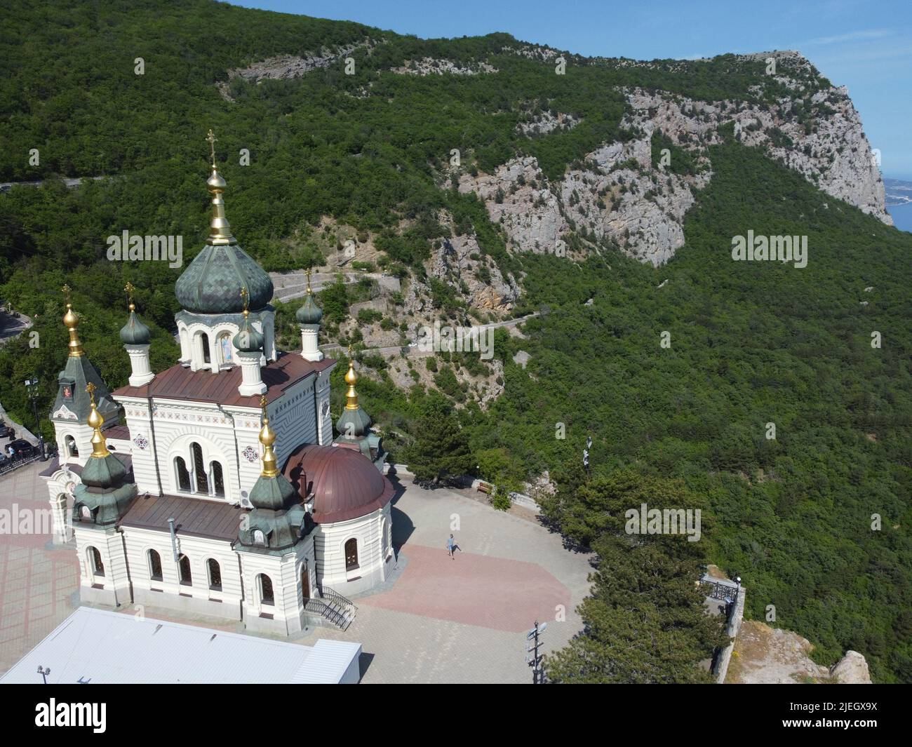 Aerial View of Foros Church and Mount road through the spring forest ...