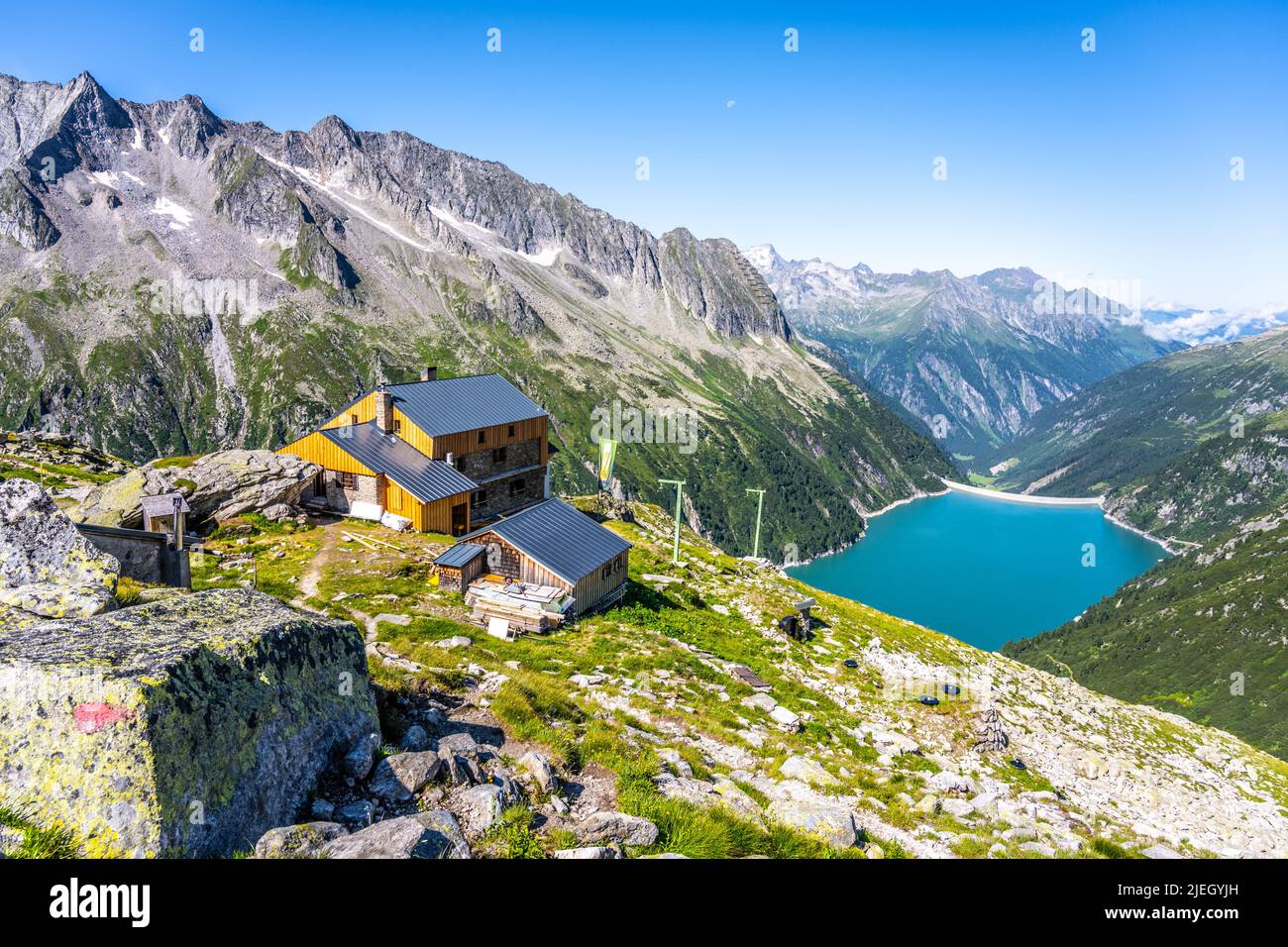 Alpine valley and mountain hut Stock Photo - Alamy