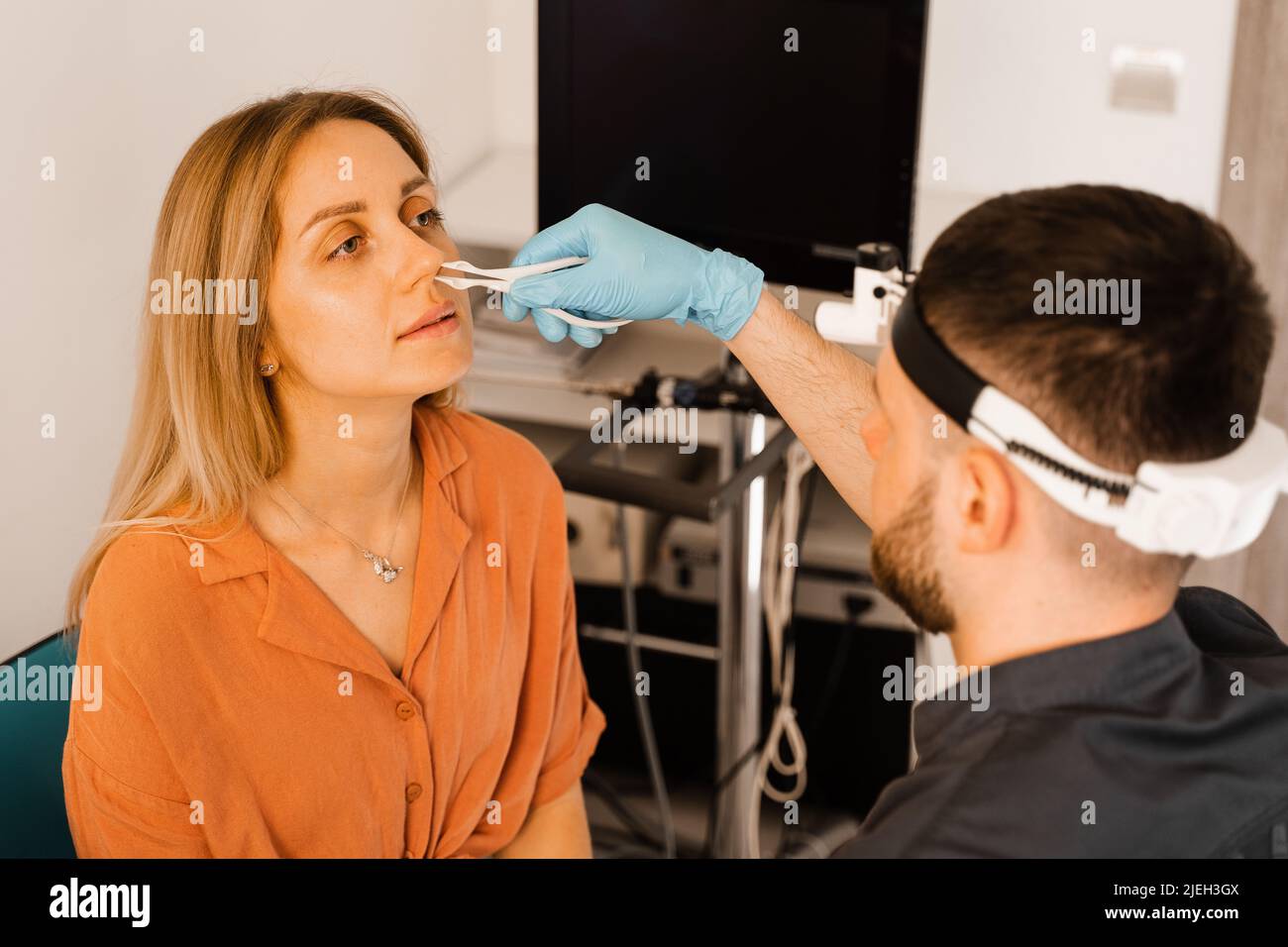 Rhinoscopy of woman nose. Consultation with doctor. Otolaryngologist ...