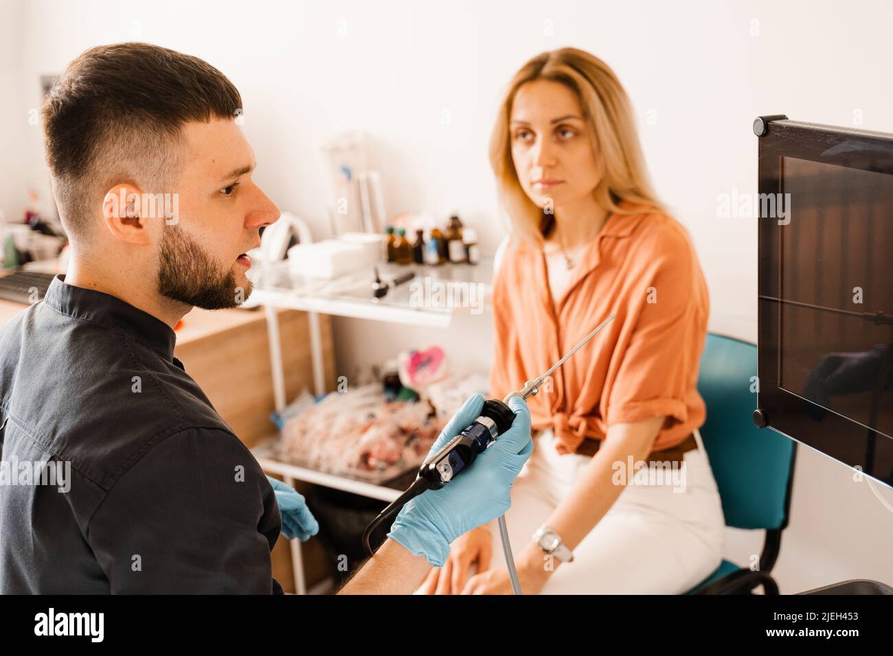 Doctor otolaryngologist with rhinoscope for endoscopy. Consultation ...