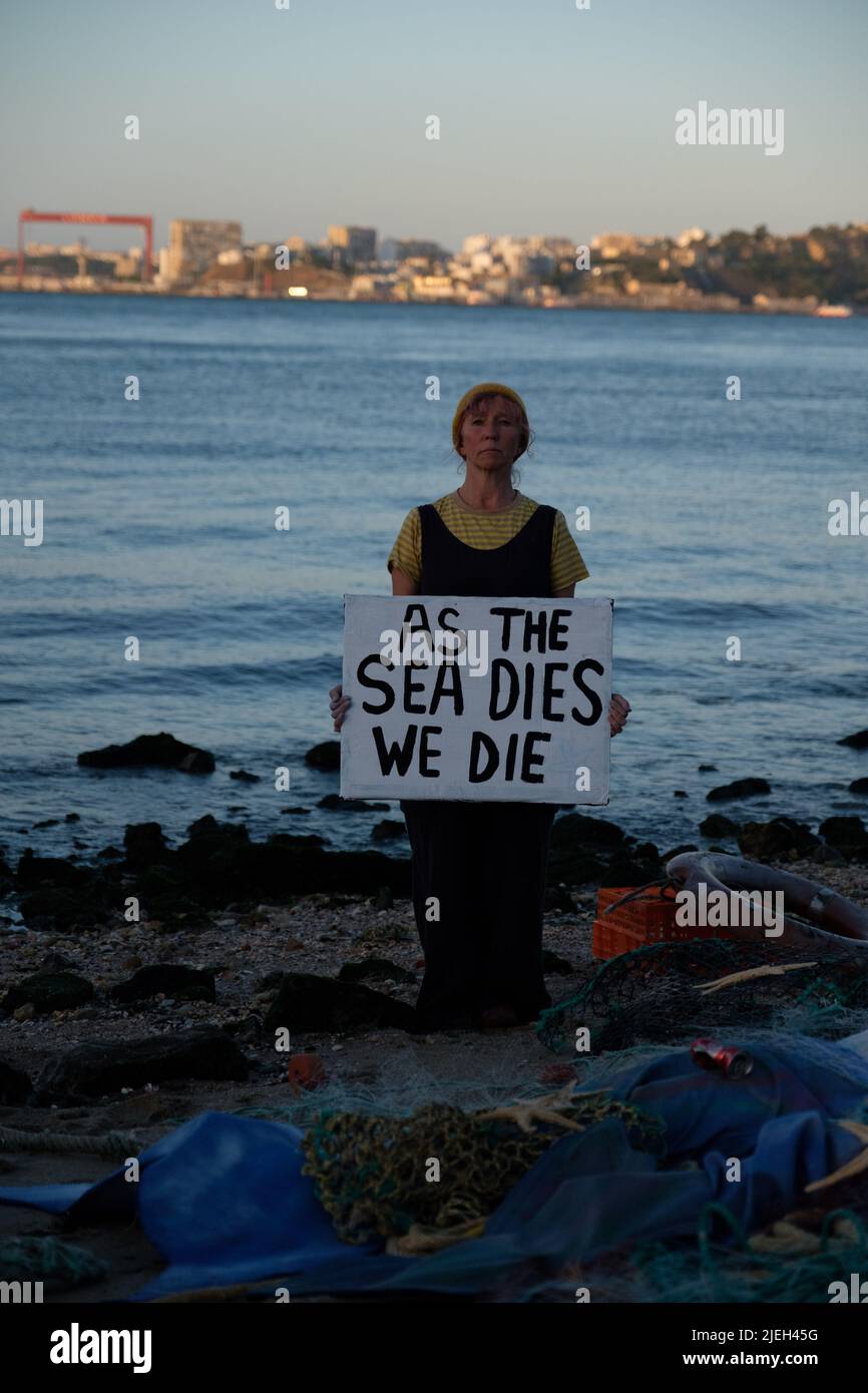 Lisbon, Portugal. 27th JUN 2022. Members of Ocean Rebellion perform a ...