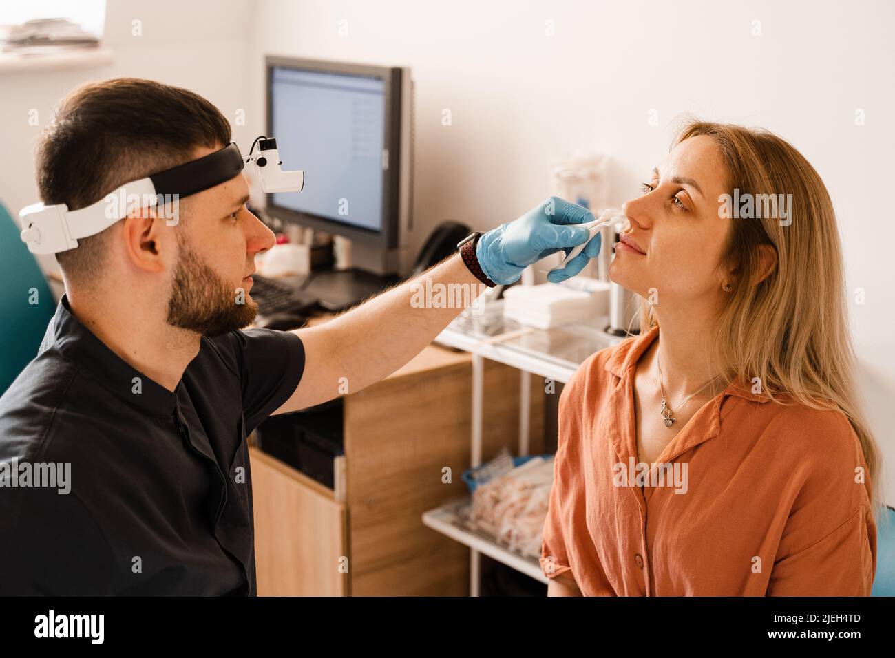 Rhinoscopy of woman nose. Consultation with doctor. Otolaryngologist ...