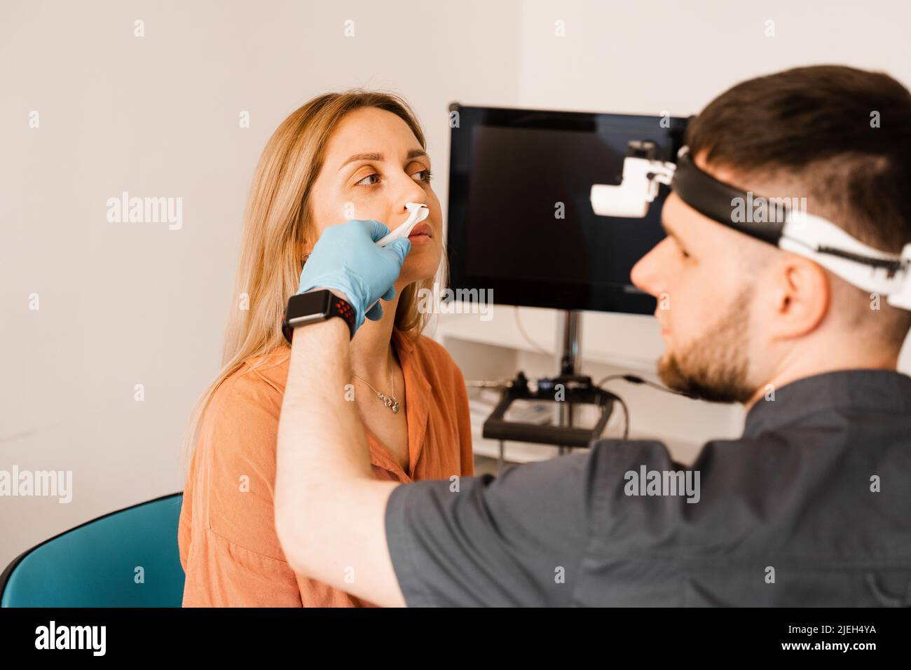 Rhinoscopy of woman nose. Consultation with doctor. Otolaryngologist ...