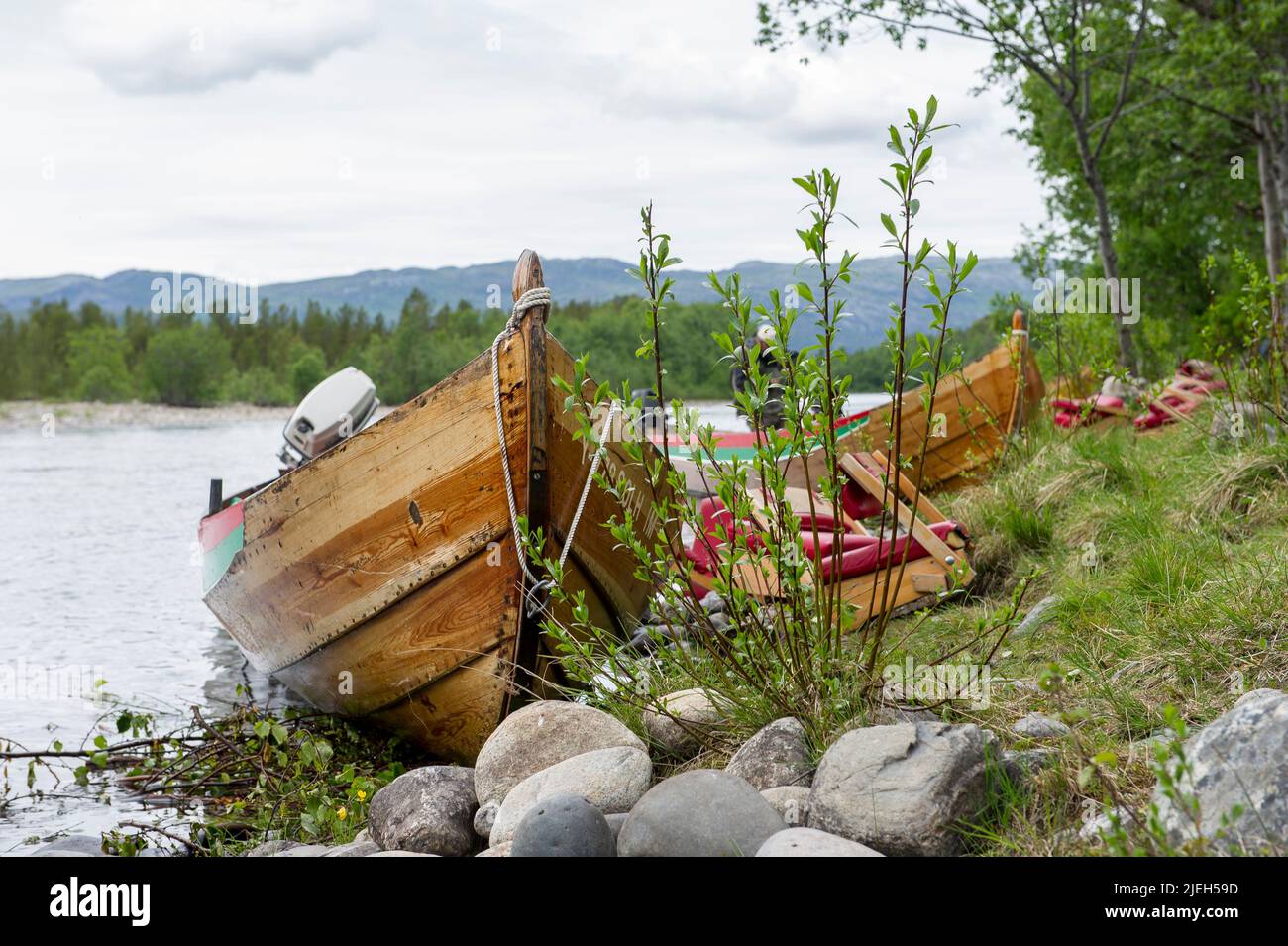 Wooden canoes to explore the Norwegian rivers Stock Photo - Alamy