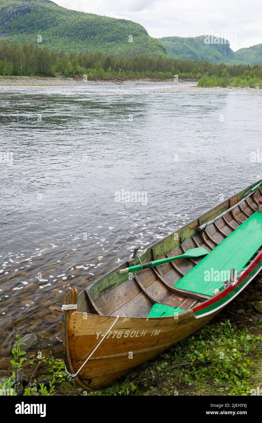 Wooden canoes to explore the Norwegian rivers Stock Photo - Alamy