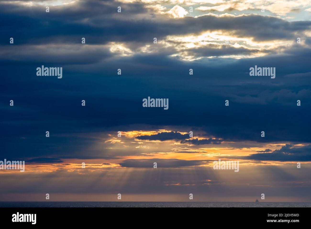 View of the Midnight Sun in the Barents Sea, from the deck of a ship ...