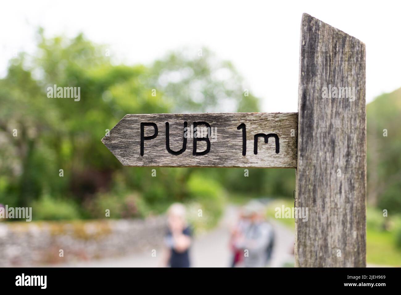 Pub walk - Pub 1m sign - Milldale, Peak District, England, UK Stock ...