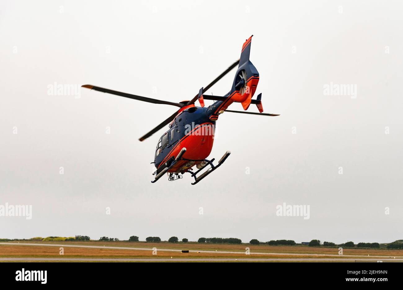 Cornwall, England, UK. 2022. A modern helicopter in flight with covered ...