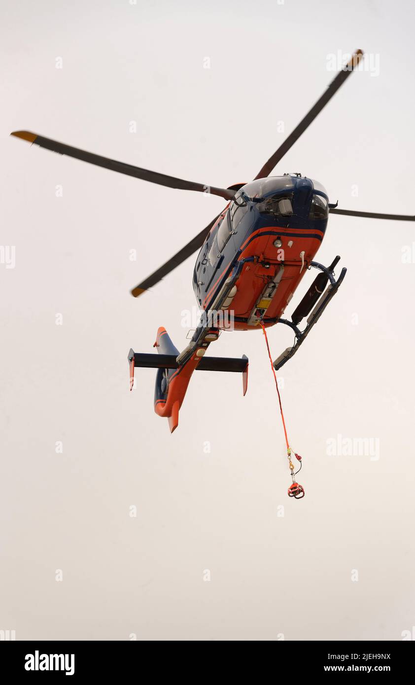 Cornwall, England, UK. 2022. A modern helicopter in flight with covered ...