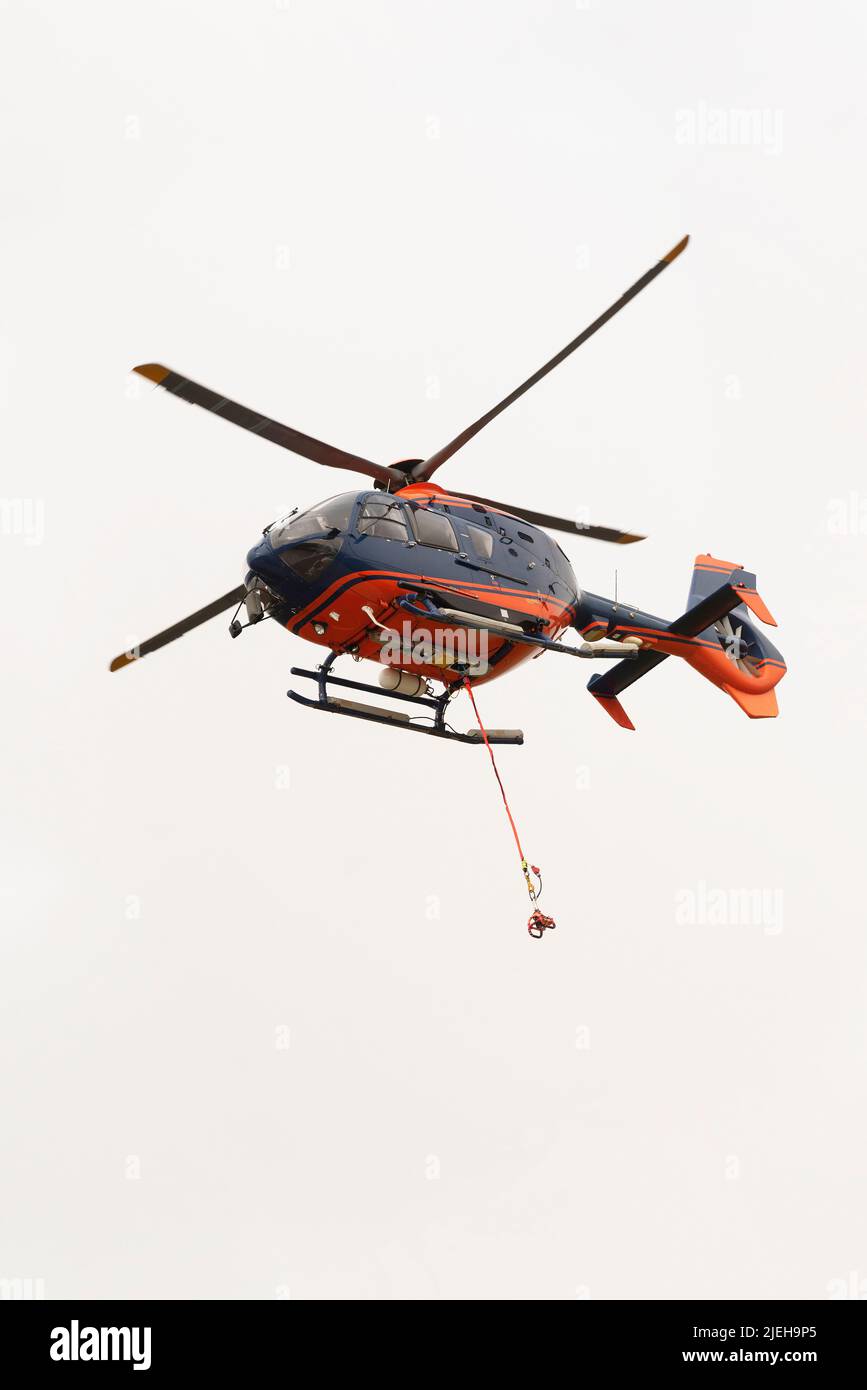 Cornwall, England, UK. 2022. A modern helicopter in flight with covered ...