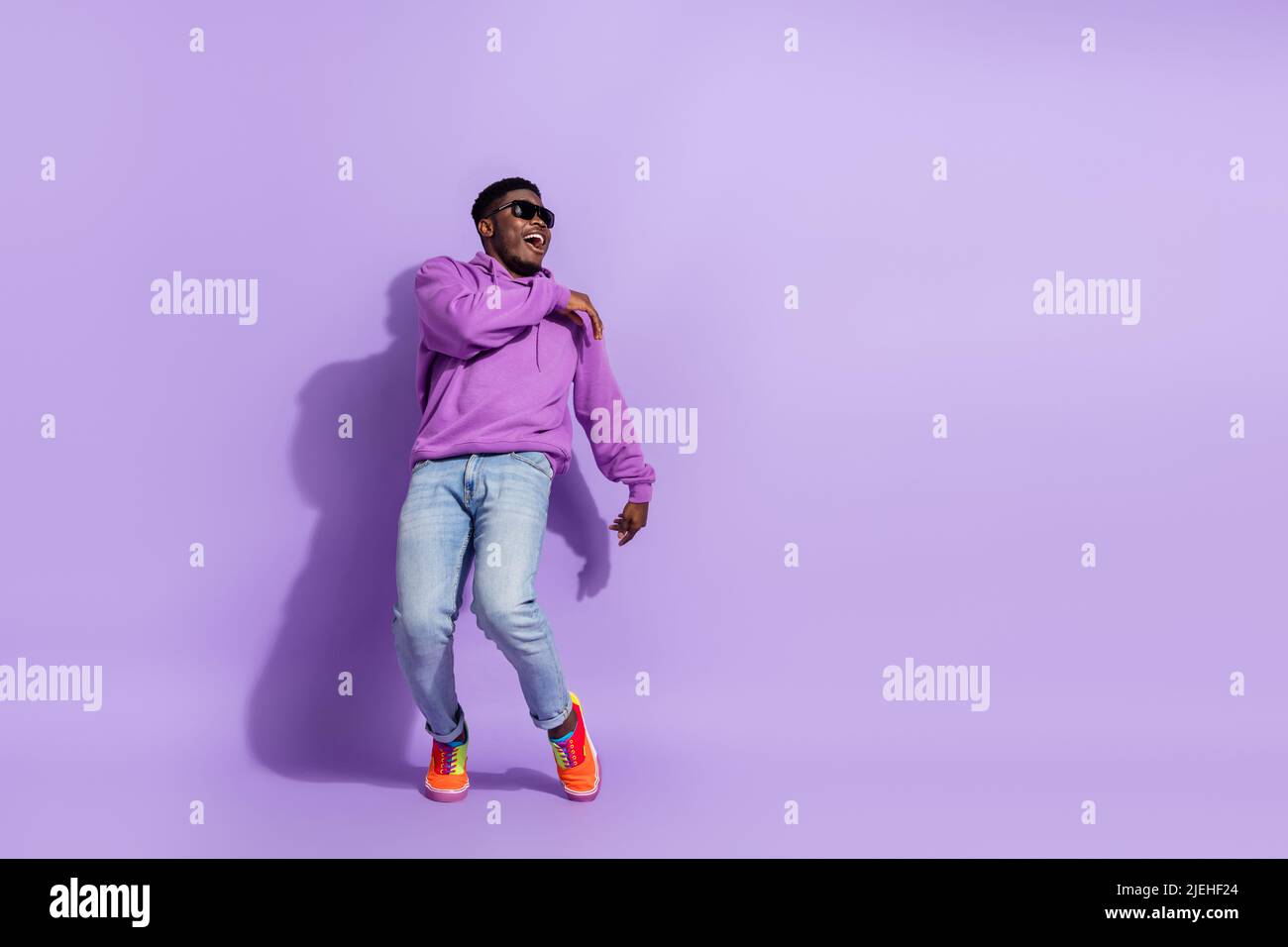 Full body photo of excited positive man rejoice clubbing spend pastime ...