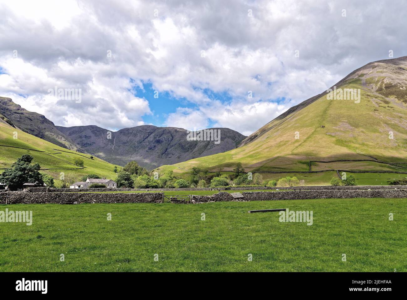 The remote countryside at Wasdale Head with a farmhouse surrounded by ...