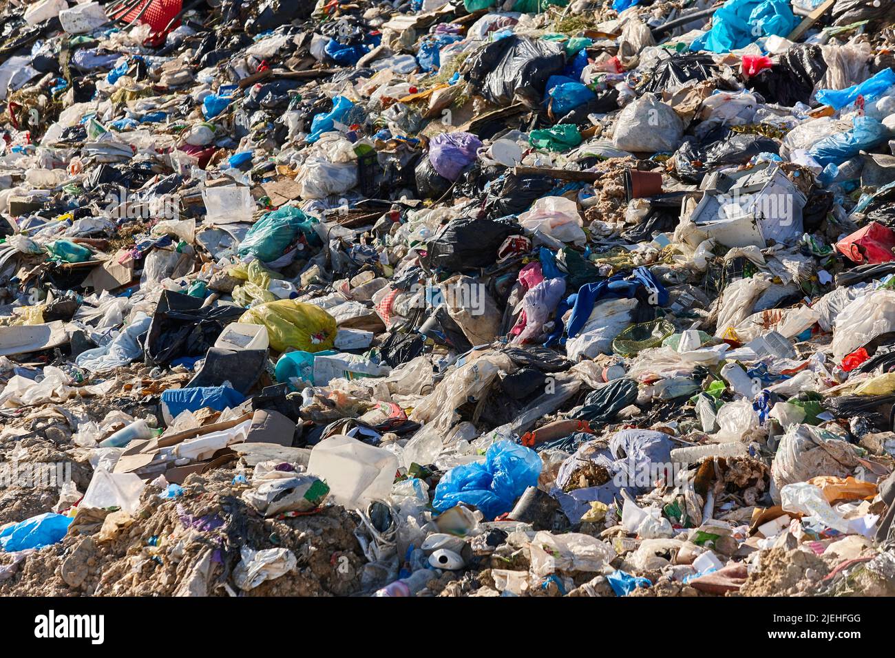 Open air garbage dump. Plastic pollution. Recycling junk. Consumerism ...