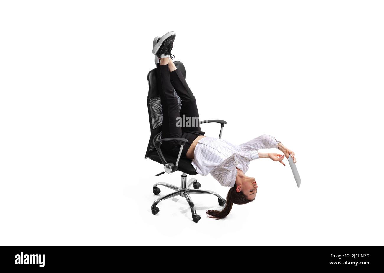 Business woman lying on chair with legs up, working on tablet isolated ...