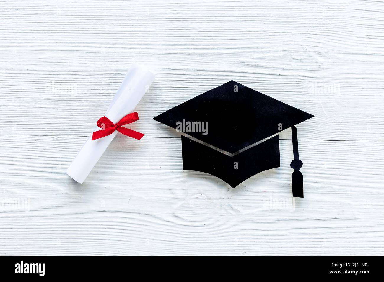 Education concept. Graduation hat or academic cap paper cut with ...