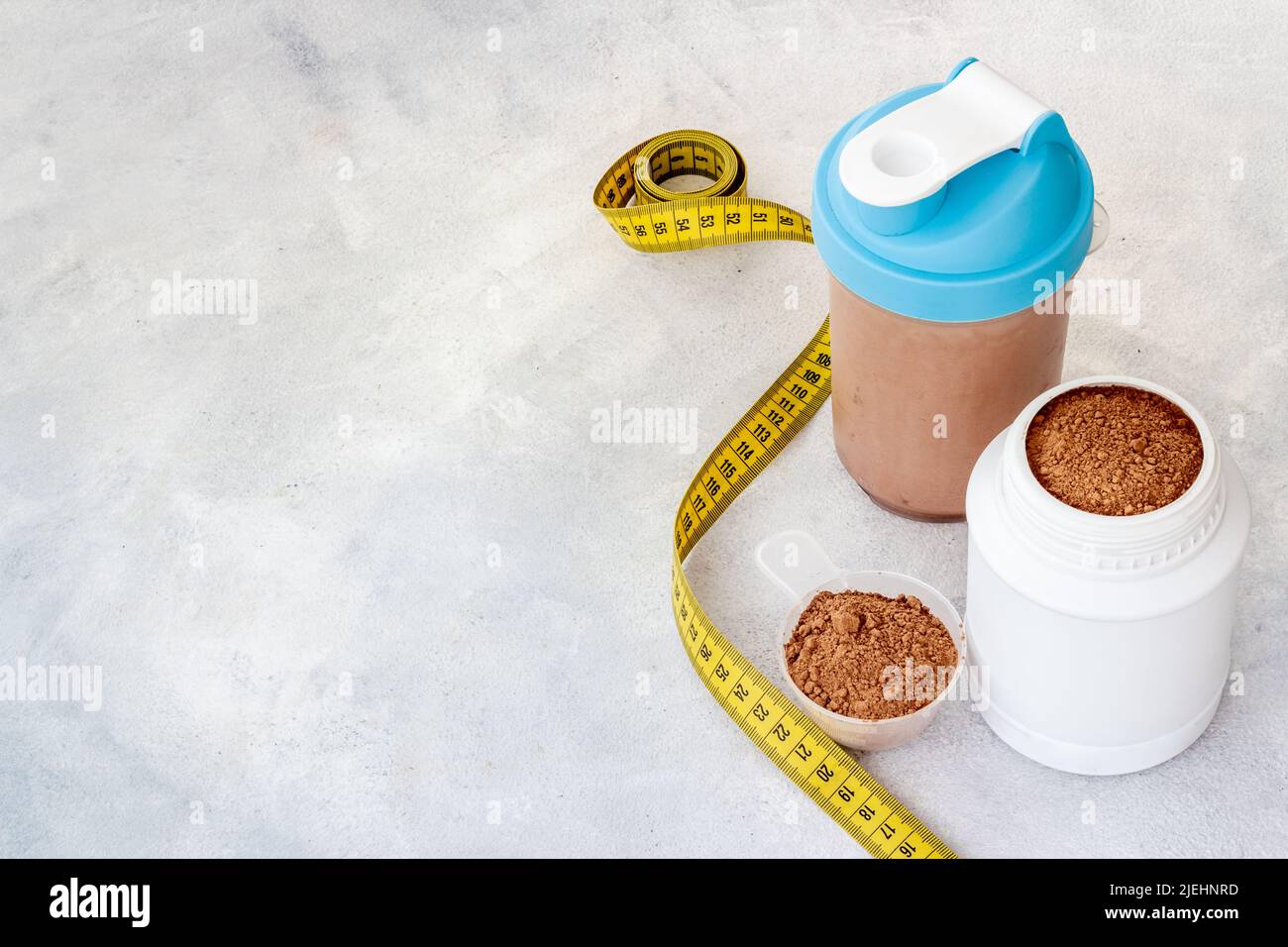 Food supplement for training - whey protein in jar and shaker Stock ...
